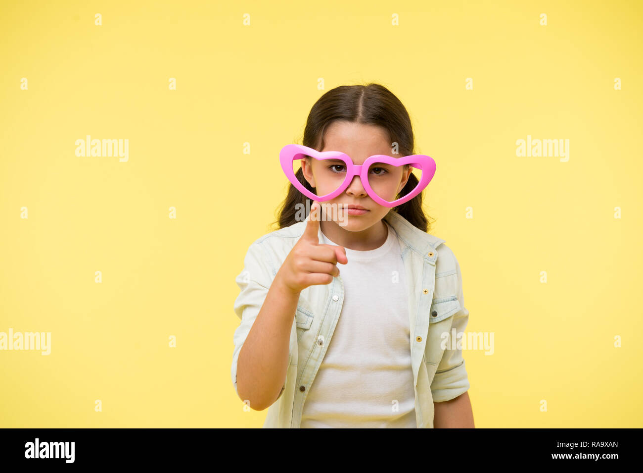 You send me valentines card. Child calm strict face pointing forward ...