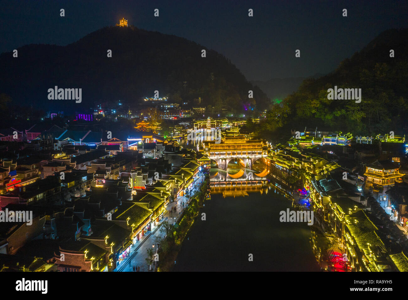 Beautiful bridge and old houses in Fenghuang Ancient Town at night ...