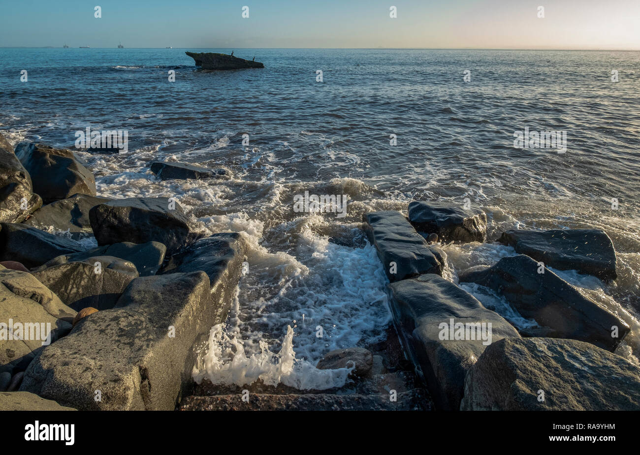 Waves lapping on rocky shore hi-res stock photography and images - Alamy