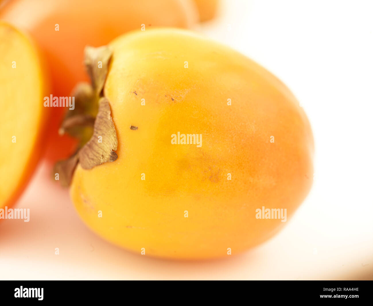 Sharon fruit against a white background fruit still-life Stock Photo ...