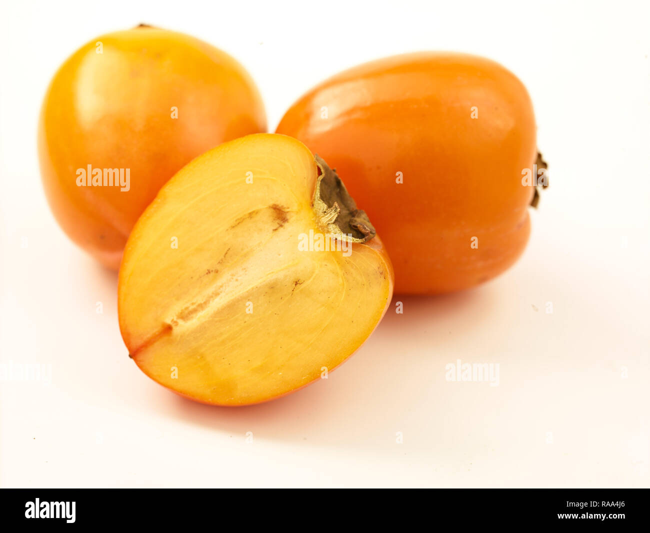 Sharon fruit against a white background fruit still-life Stock Photo ...
