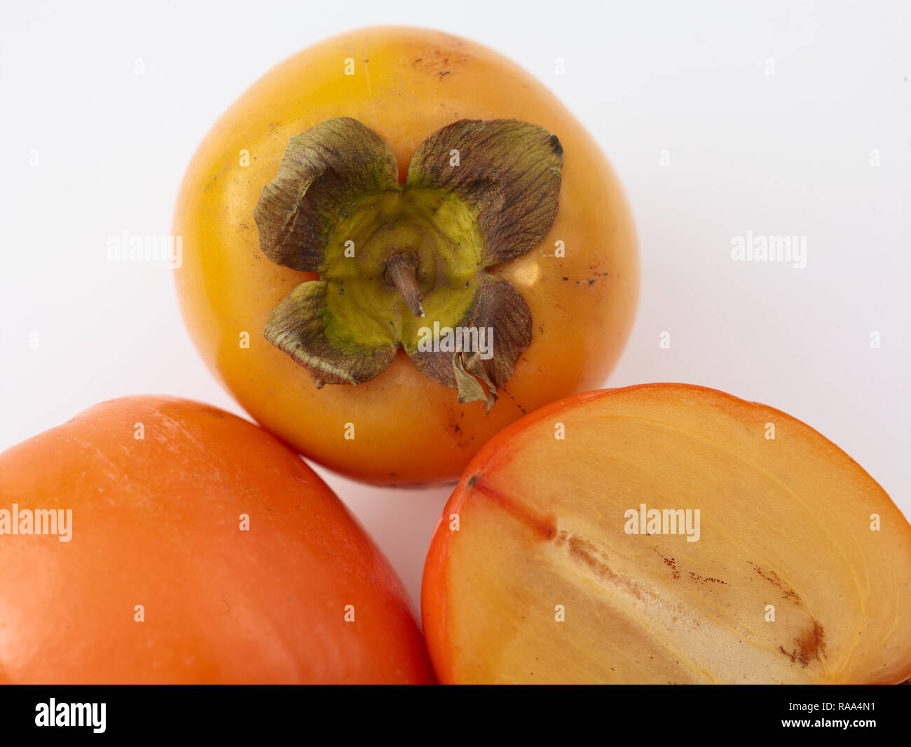 Sharon fruit against a white background fruit still-life Stock Photo ...