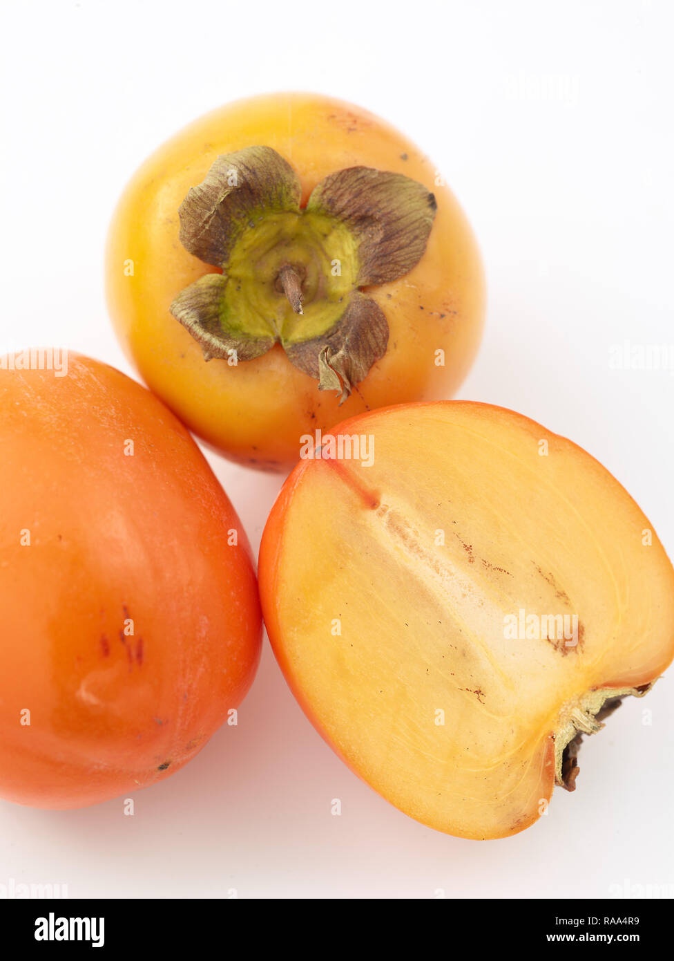 Sharon fruit against a white background fruit still-life Stock Photo ...