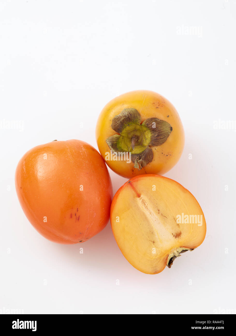 Sharon fruit against a white background fruit still-life Stock Photo ...