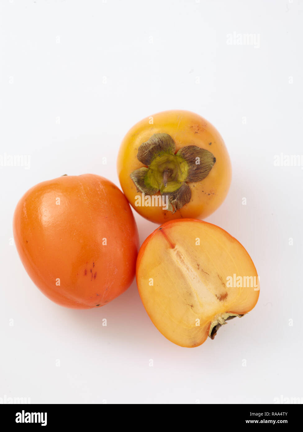 Sharon fruit against a white background fruit still-life Stock Photo ...