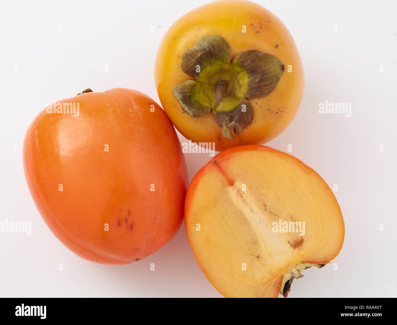 Sharon fruit against a white background fruit still-life Stock Photo ...