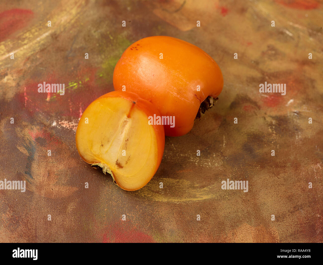 Sharon fruit against white background, food portrait Stock Photo - Alamy
