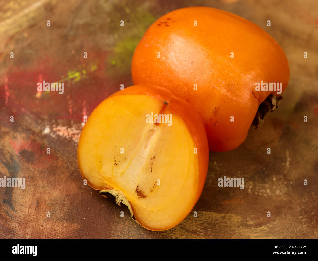 Sharon fruit against white background, food portrait Stock Photo - Alamy