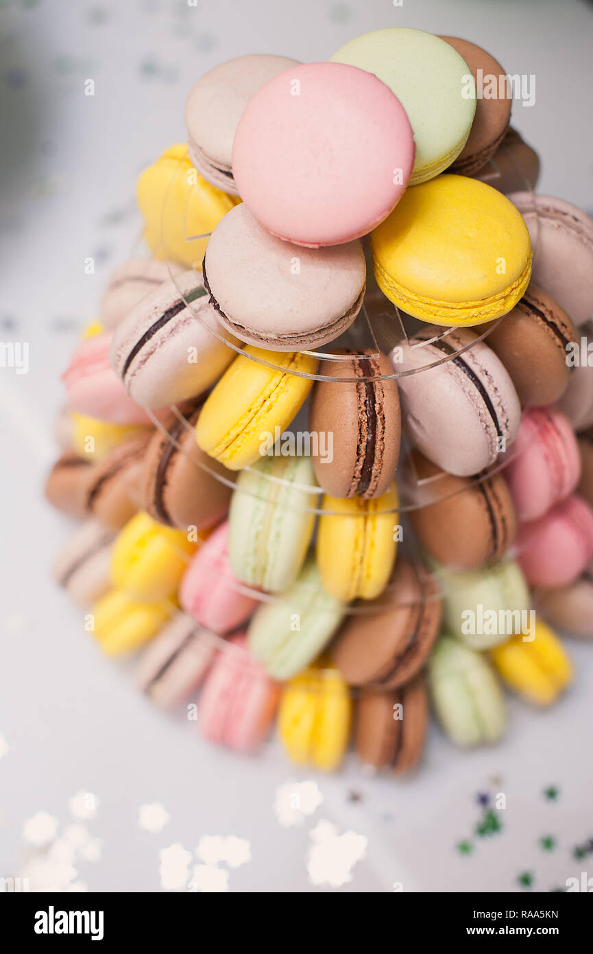 colorful french macarons multilevel cake pyramid on plastic dessert ...