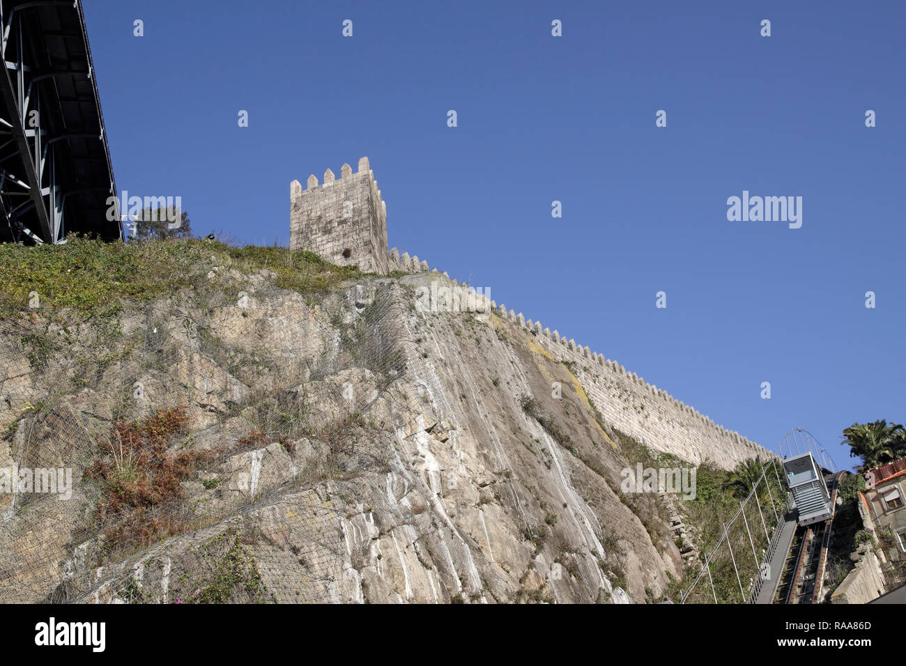 Old Porto architecture seeing old medieval wall over granite hill, the ...