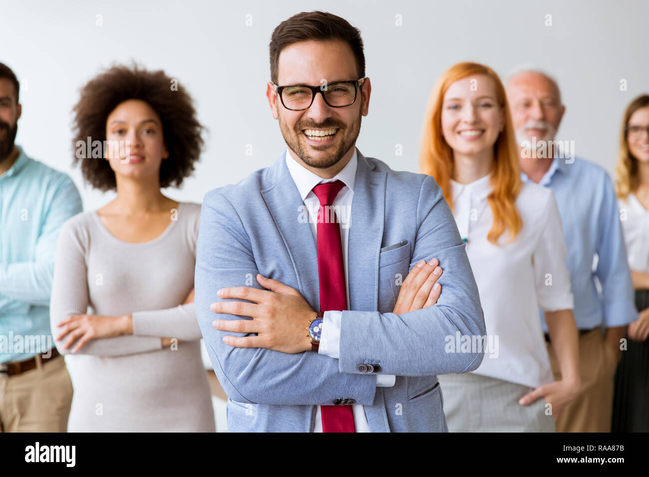 Line of happy and positive business people standing in the office Stock ...