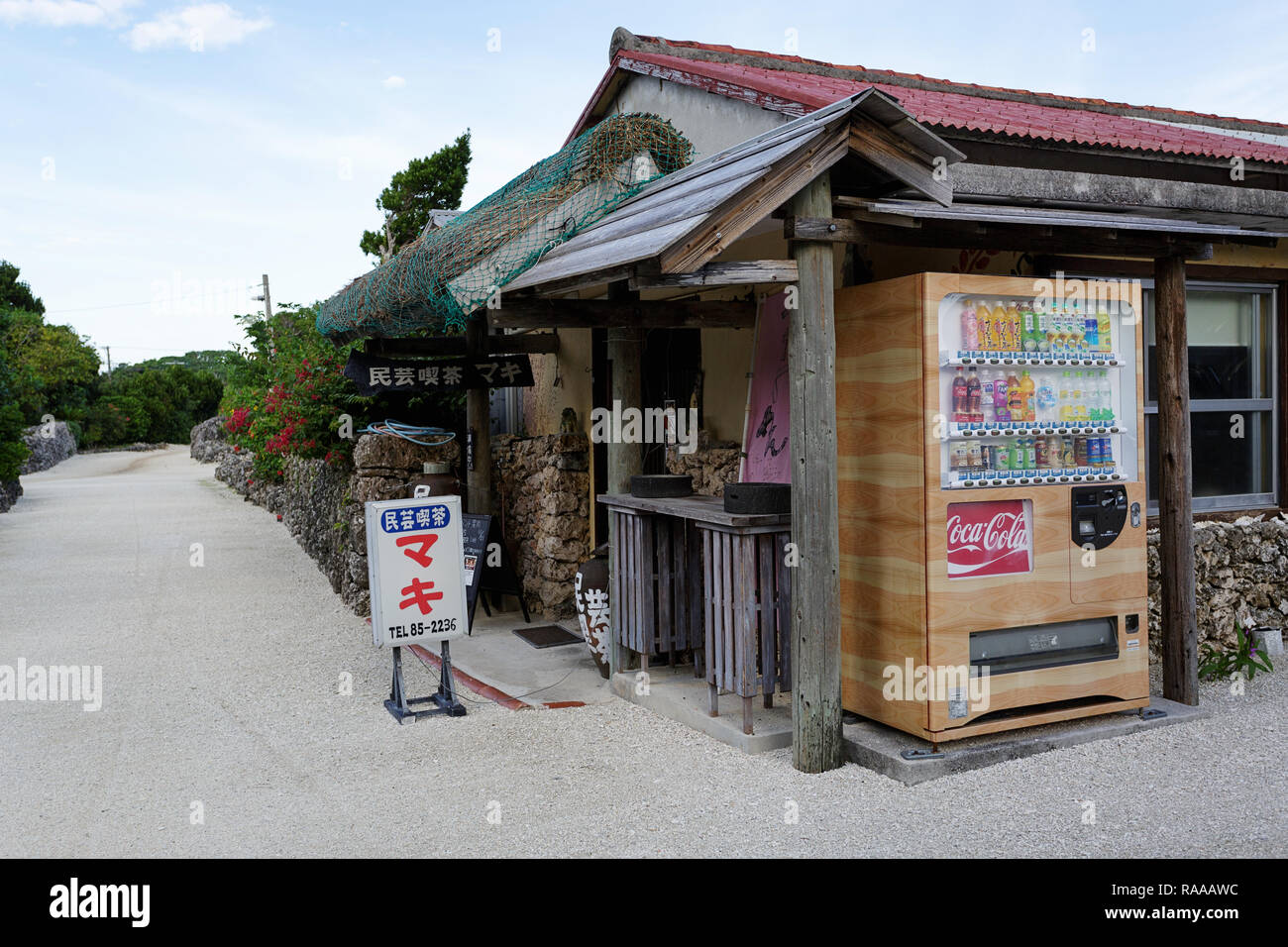 Shop with vending machine on the street with traditional stonewalls at ...