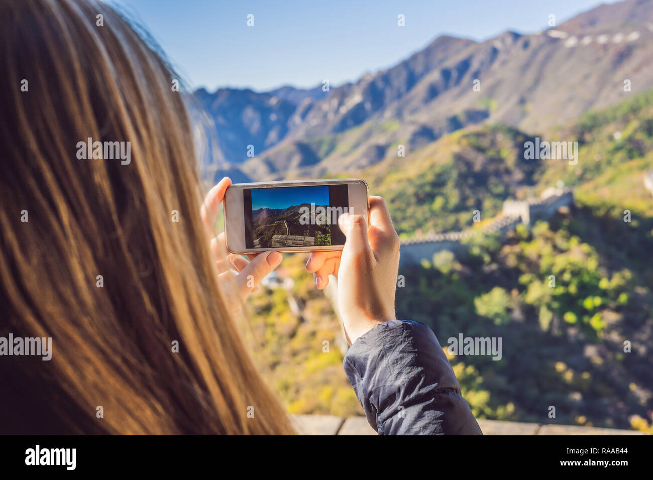 Happy cheerful joyful tourist woman at Great Wall of China having fun ...