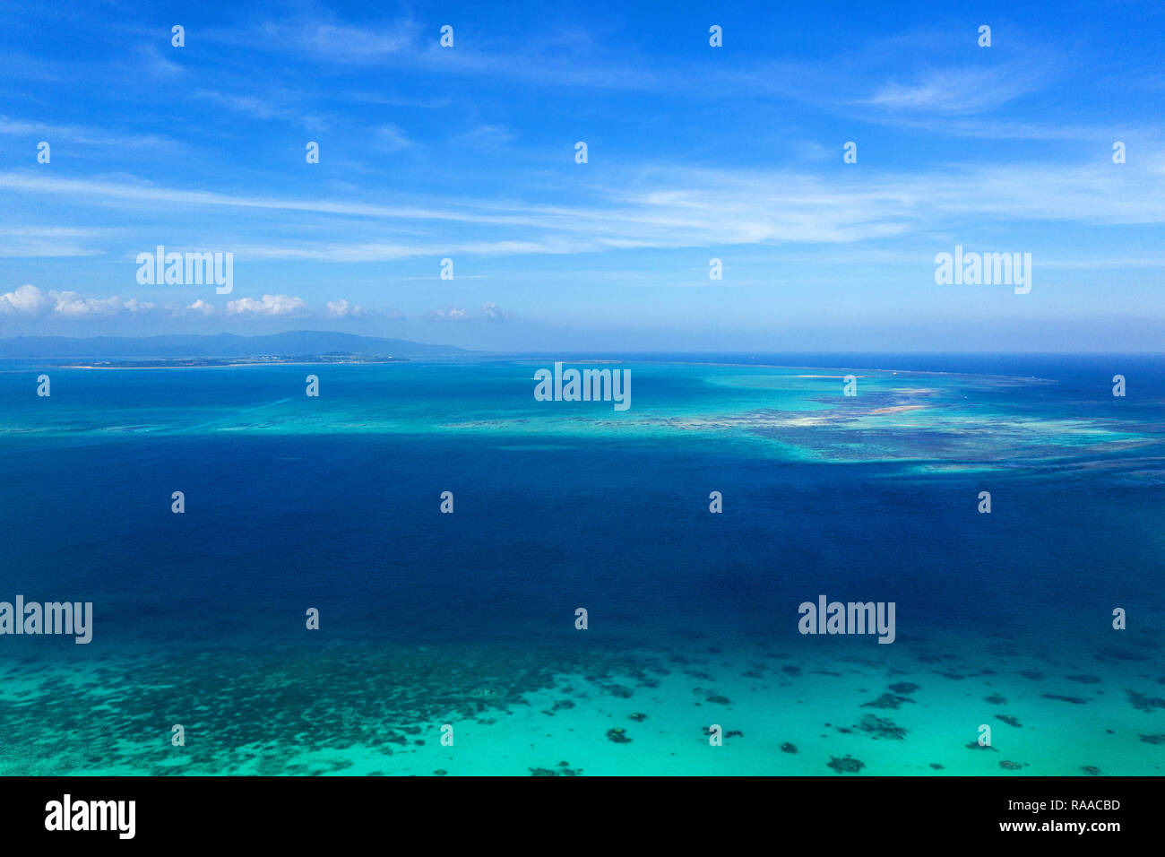 Aerial view of spectacular coral reef and clear turquoise waters on ...