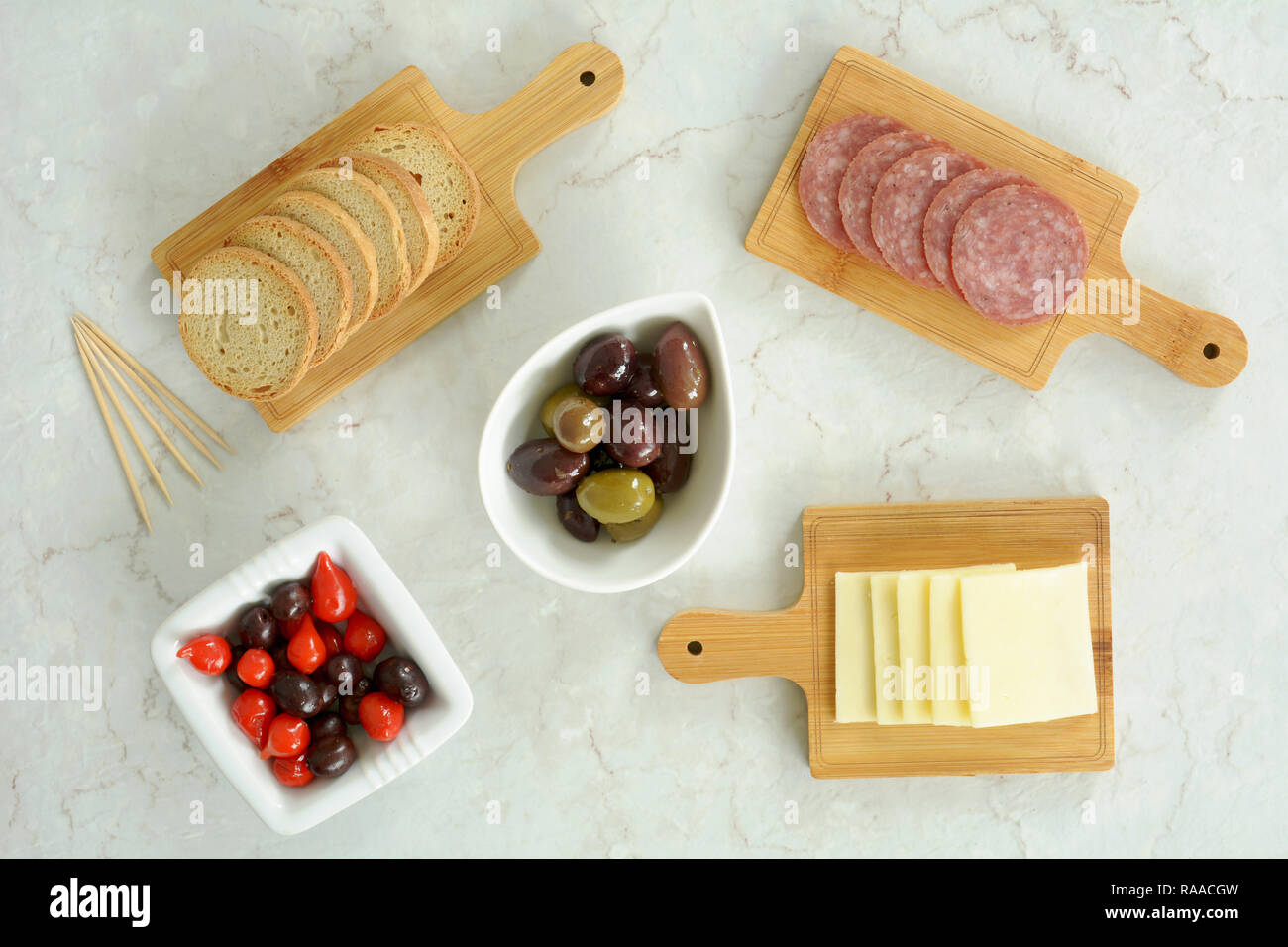 Spread of appetizers on mini bamboo trays in horizontal format shot ...