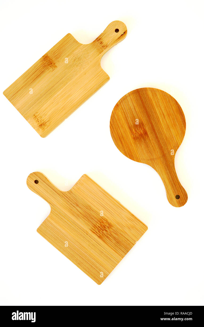Empty mini bamboo appetizer trays on white background shot from above ...