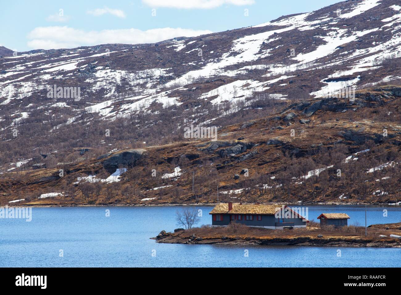 traditional norwegian wooden house to stand at the lakeside and ...