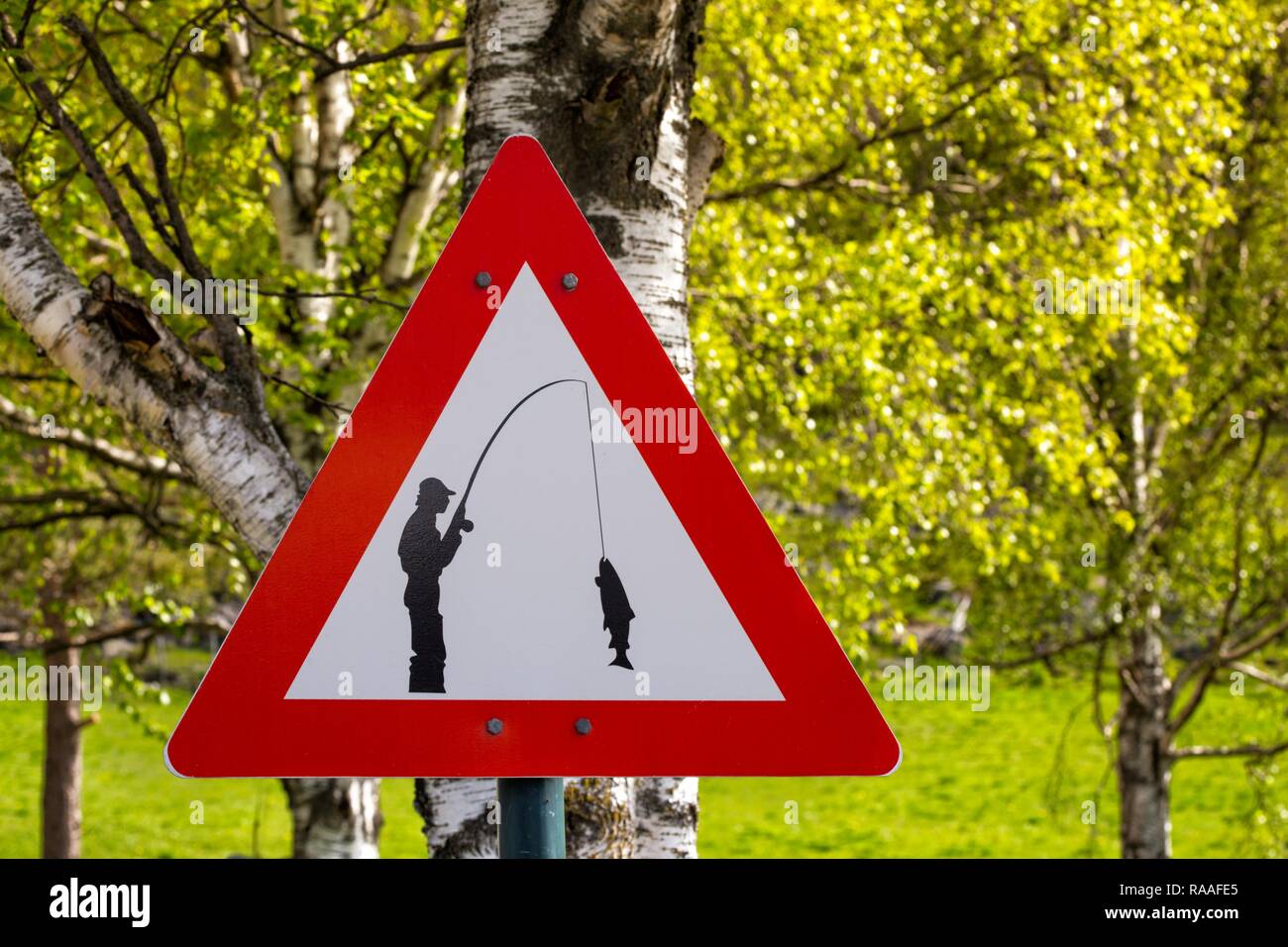 road sign - carefully fisherman catches a fish, norway Stock Photo - Alamy