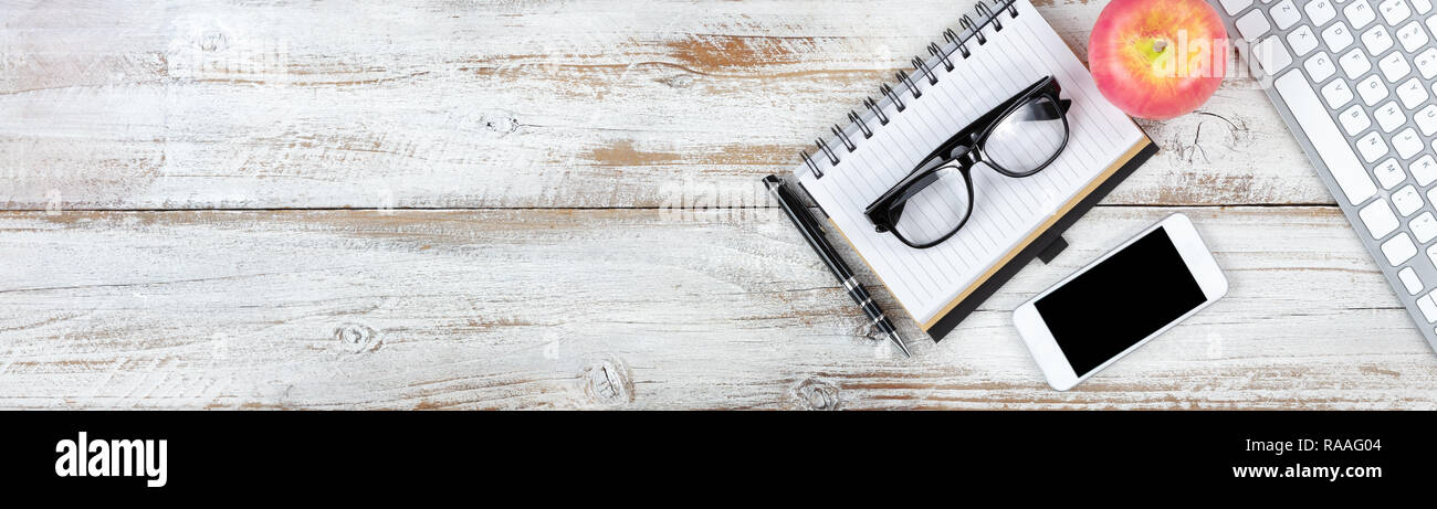 Overhead view of white rustic working desktop in horizontal format ...