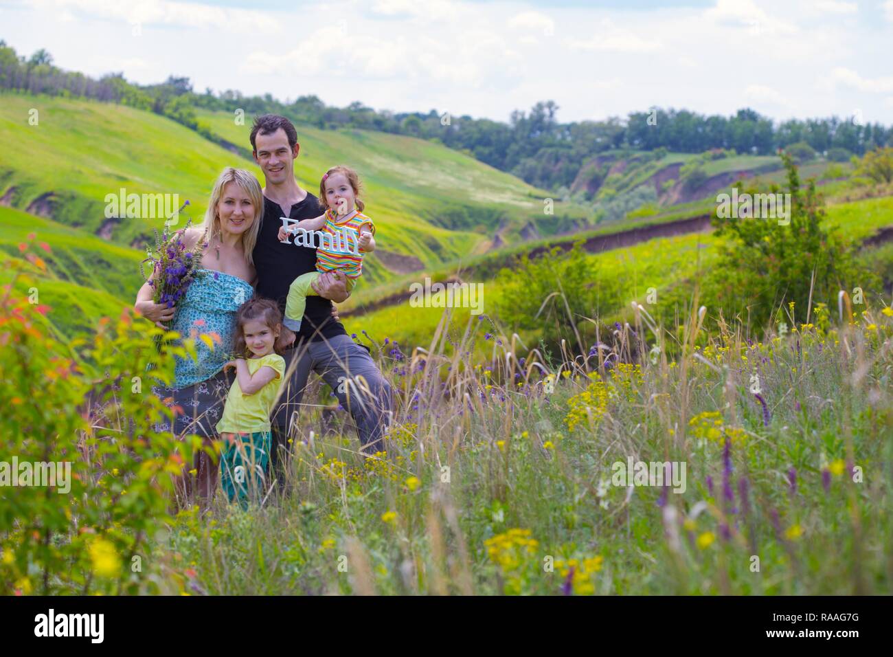 happy family with smiling faces outdoors Stock Photo - Alamy