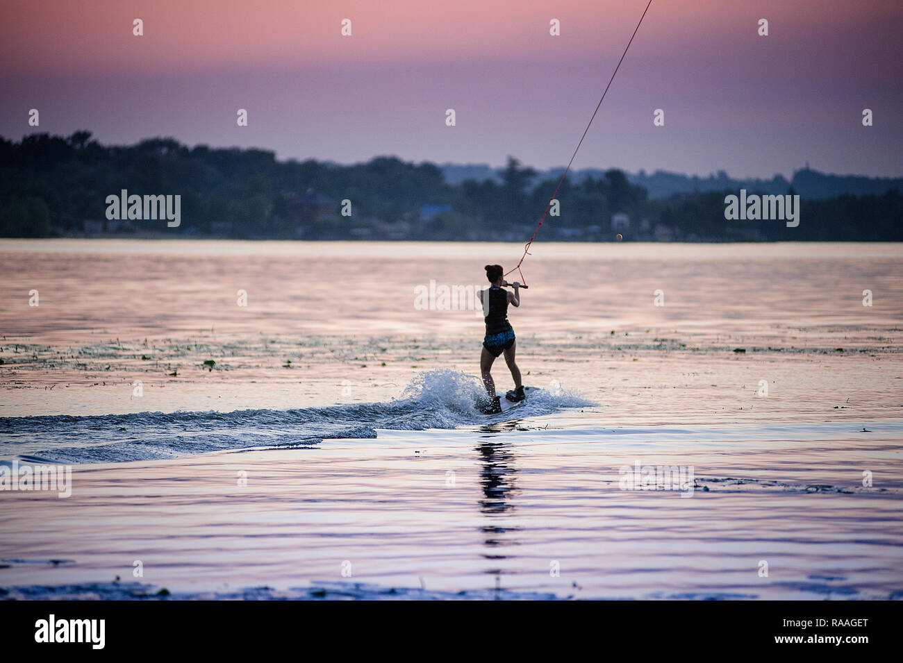 Wakeboarding woman silhouette hi-res stock photography and images - Alamy