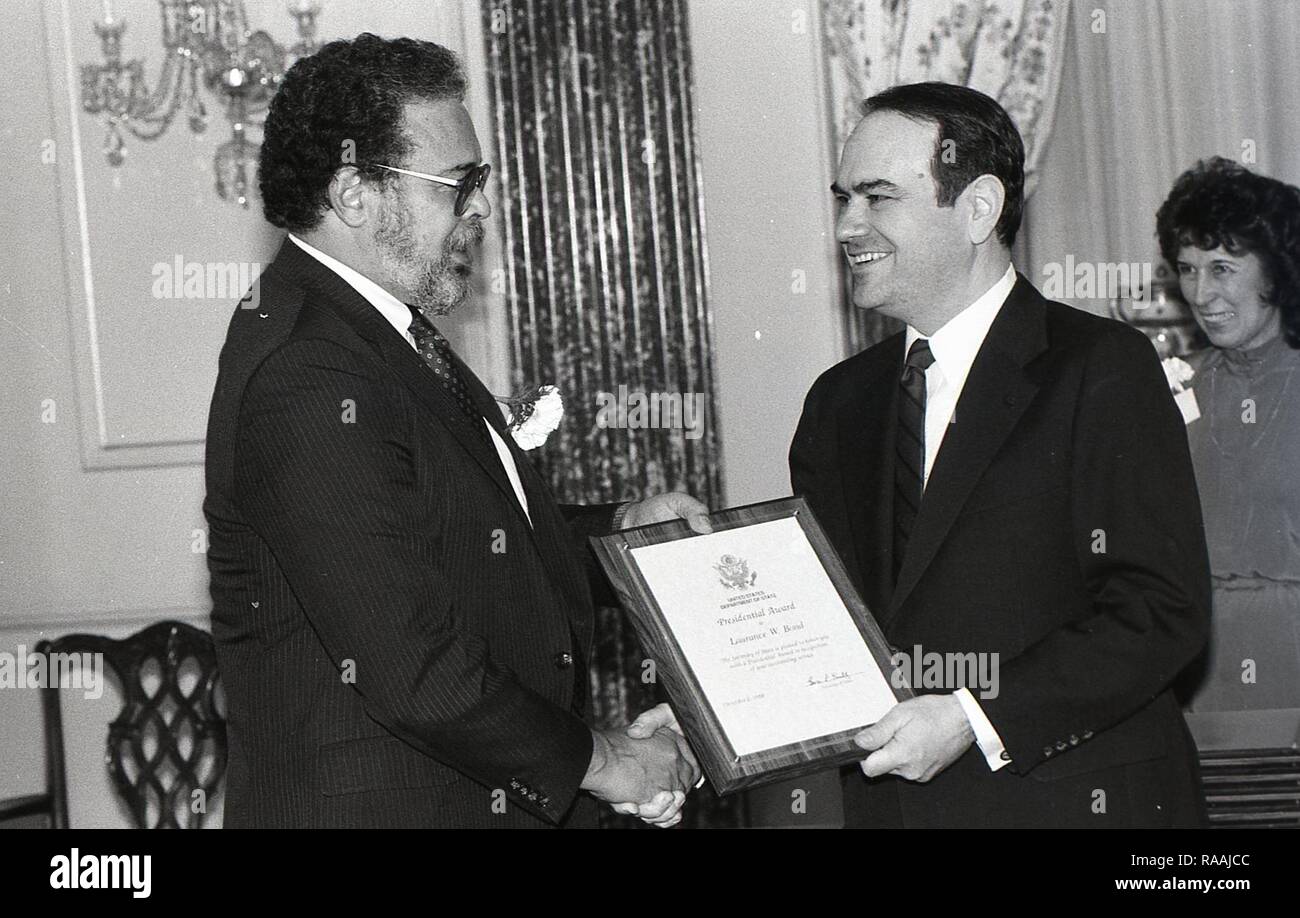 MAN GREETING ANOTHER MAN WITH AWARD Stock Photo - Alamy