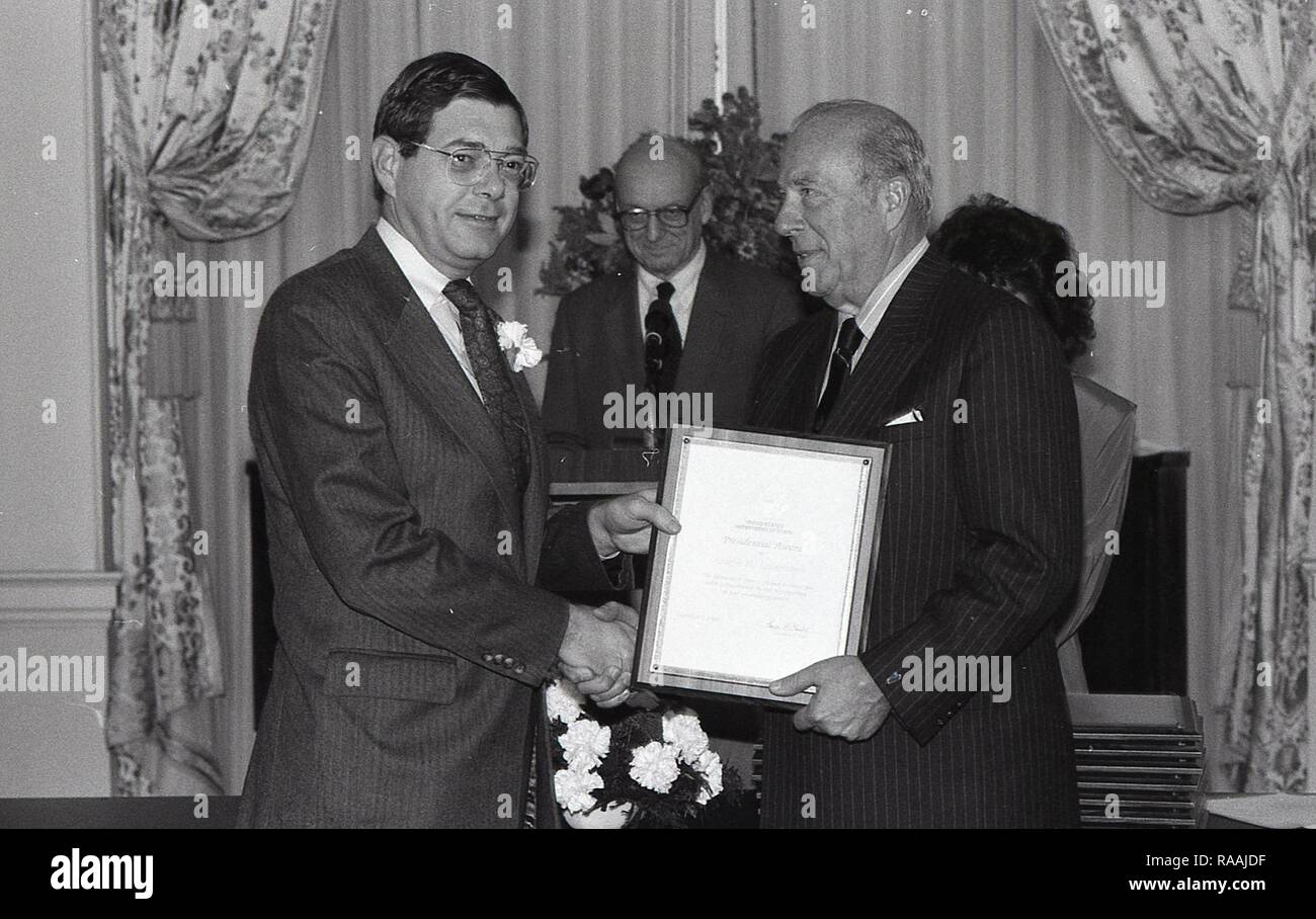 MAN GREETING ANOTHER MAN WITH AWARD Stock Photo - Alamy
