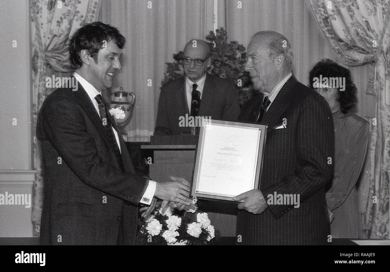 MAN GREETING ANOTHER MAN WITH AWARD Stock Photo - Alamy