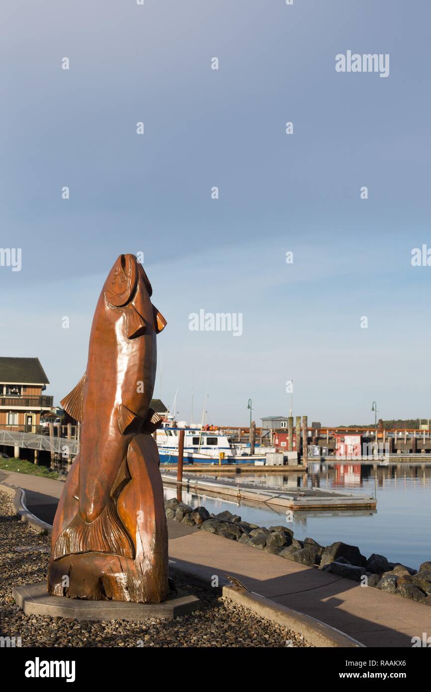 A large wooden fish sculpture next to the marina in Bandon, Oregon, USA ...