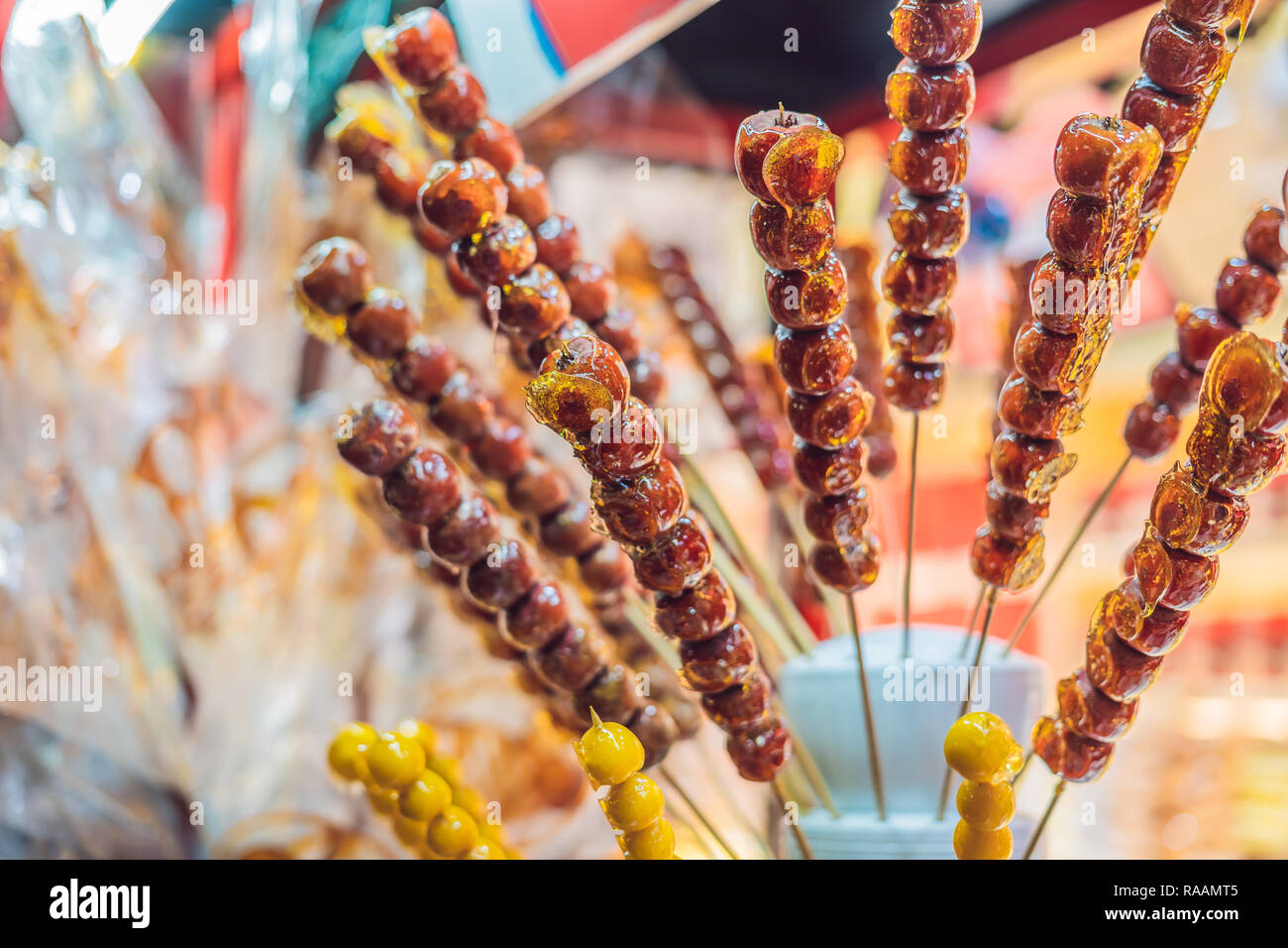 Chinese candied fruits and berries, Hawthorn and strawberries in sesame ...