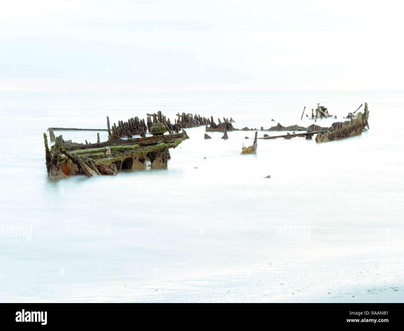 Shipwreck leftovers from a World War ship in very calm waters at a ...