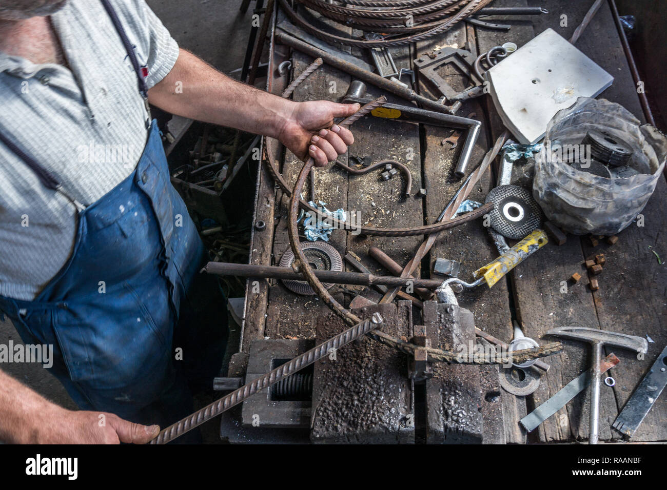 Blacksmith making wrought Iron with bender equipment machine for metal ...