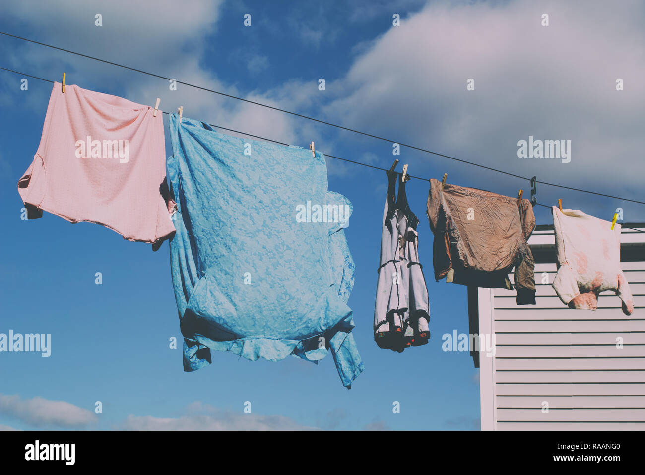 Laundry clothes line on a sunny day. Faded look Stock Photo - Alamy