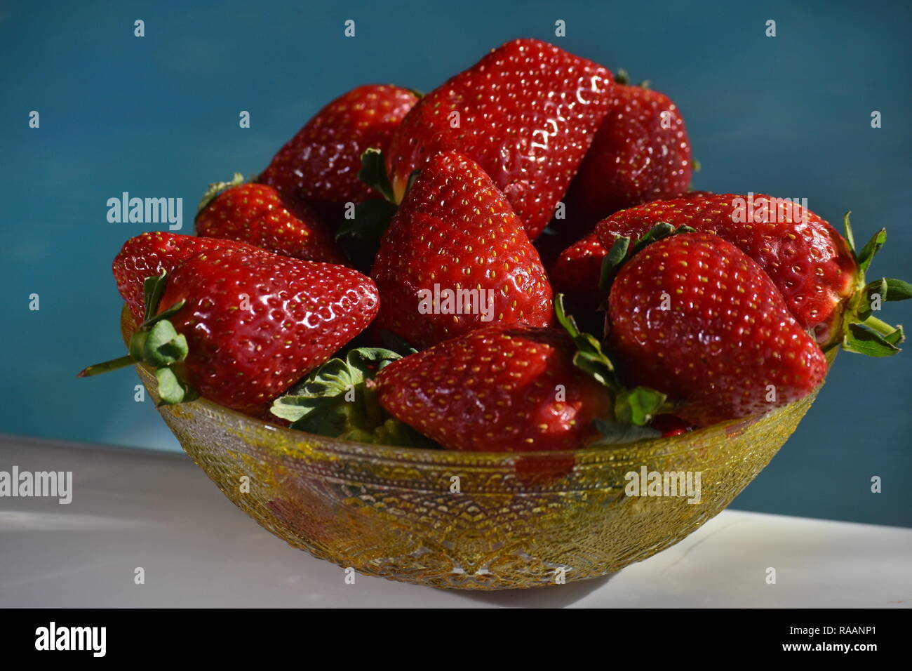 strawberries in golden dish by Jacuzzi in holiday resort Stock Photo ...