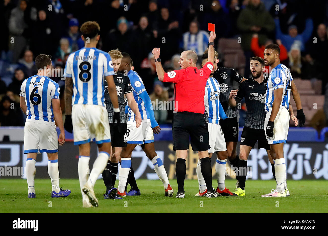 Burnley's Robbie Brady is shown a red card by referee Mike Dean during ...
