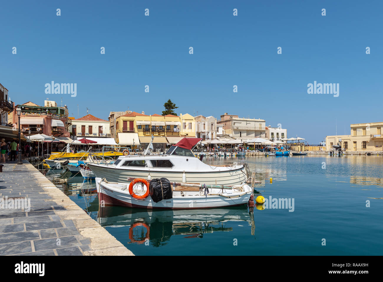 CRETE, GREECE - AUGUST 2018: Traditional Greek fishing boats are moored ...