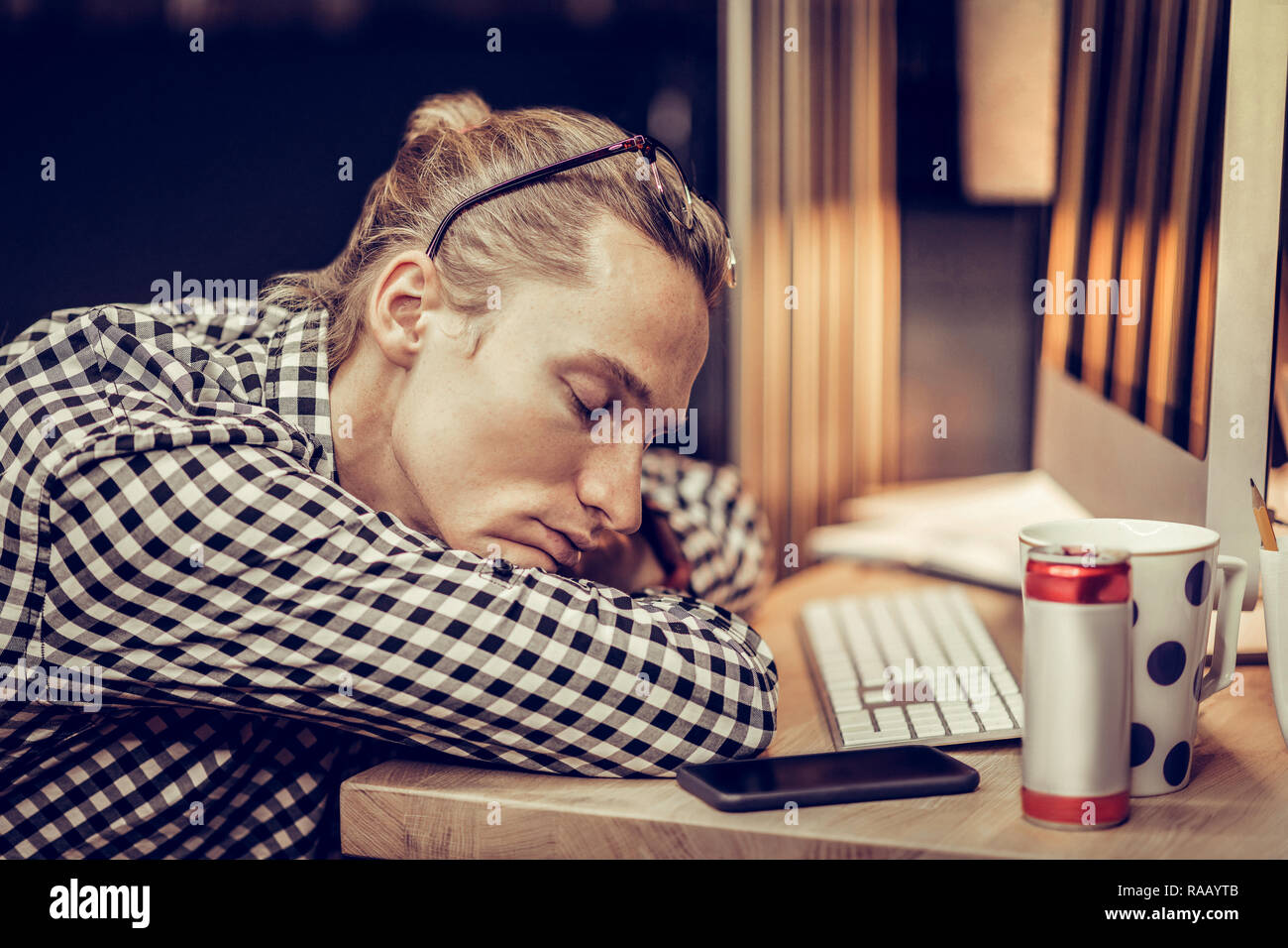 Tired young man lying hi-res stock photography and images - Alamy