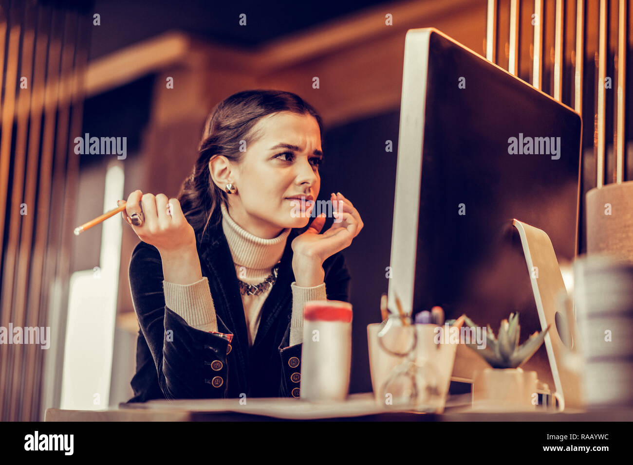 Emotional office worker staring at screen of computer Stock Photo - Alamy