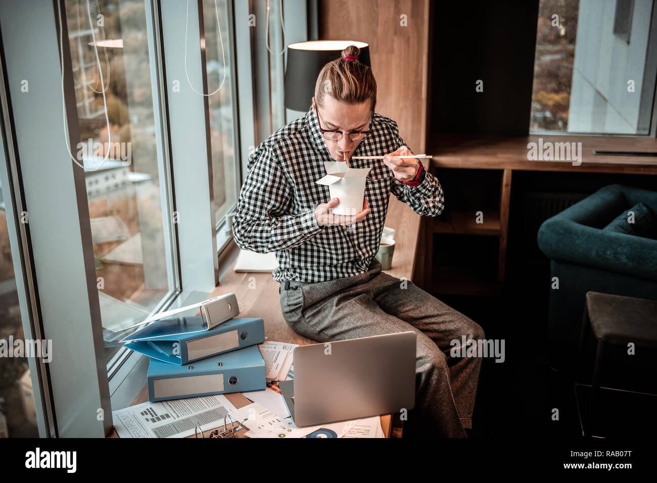 Concentrated stylish male person staring at his gadget Stock Photo - Alamy