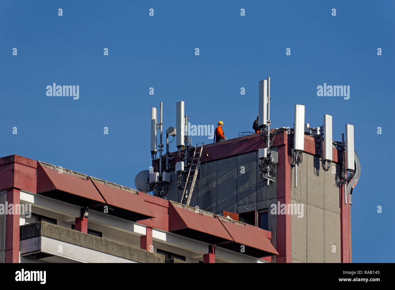 Cell phone antennae on top of building hi-res stock photography and ...