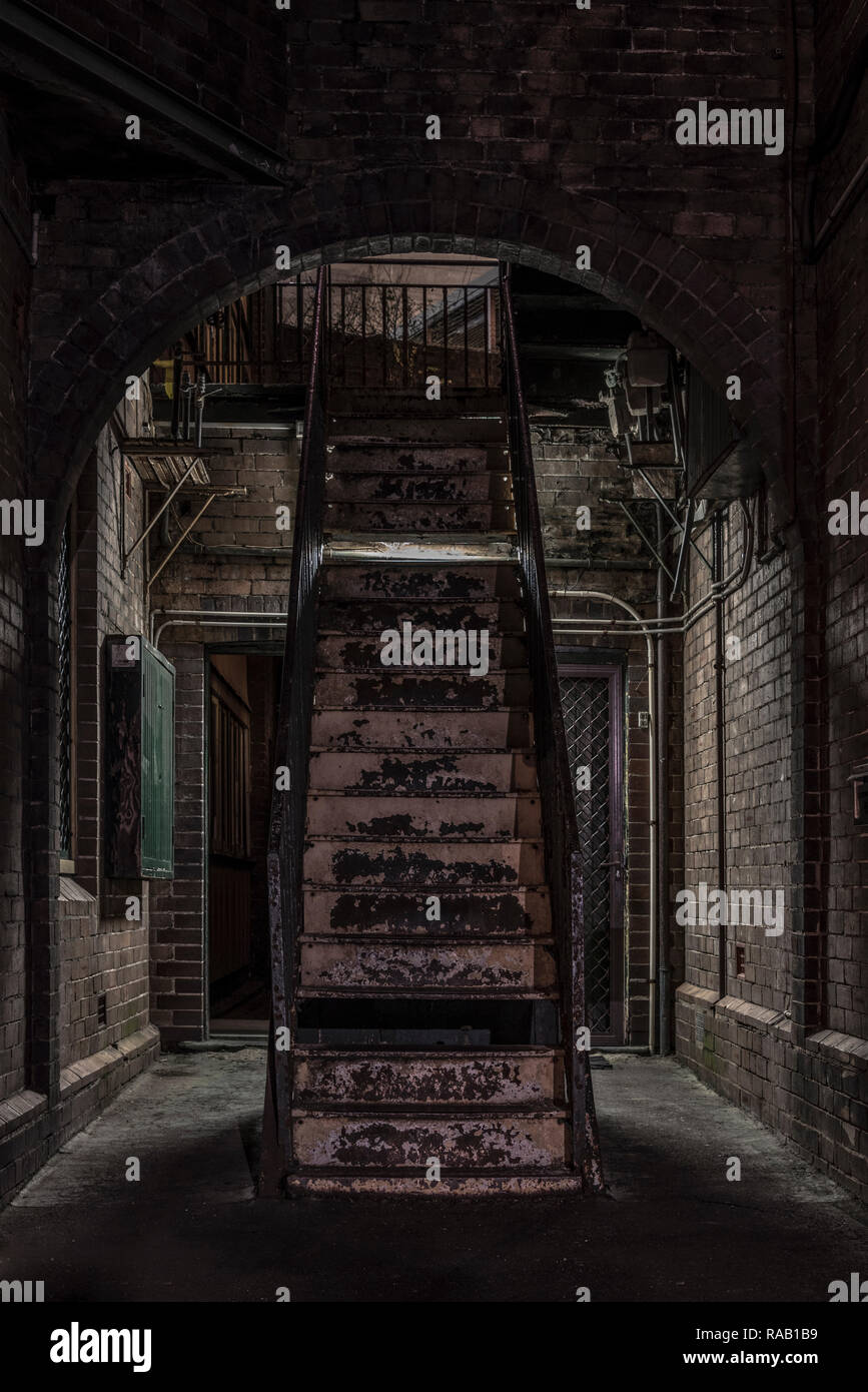 A darkened staircase at night in an urban apartment building Stock ...
