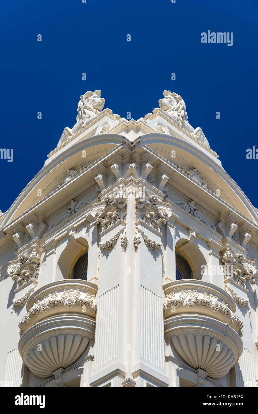 Corner of a white ornate building against a stark blue sky in Perth ...