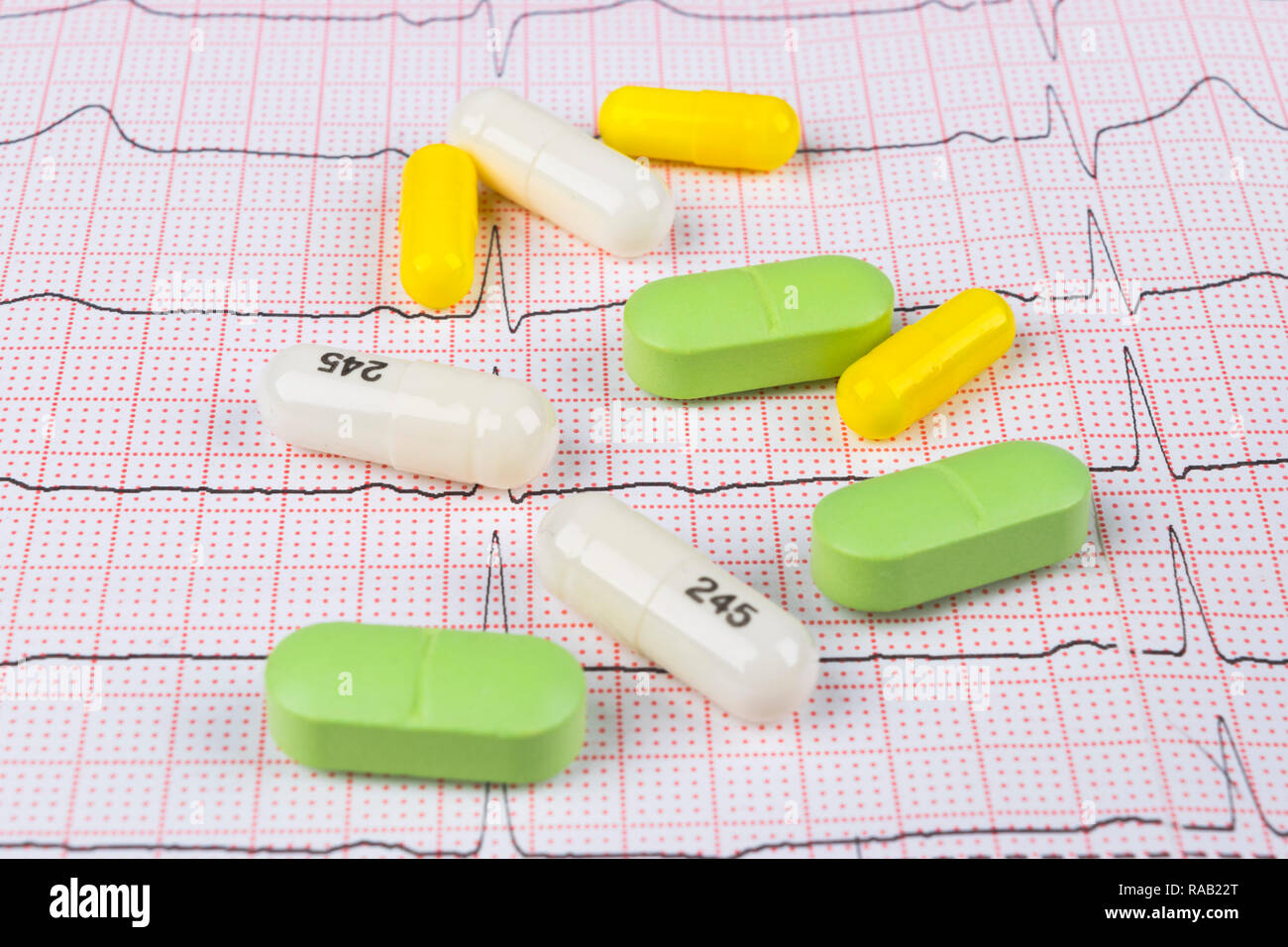 Medical cardiogram chart with pile of pills. Cardiology care health ...