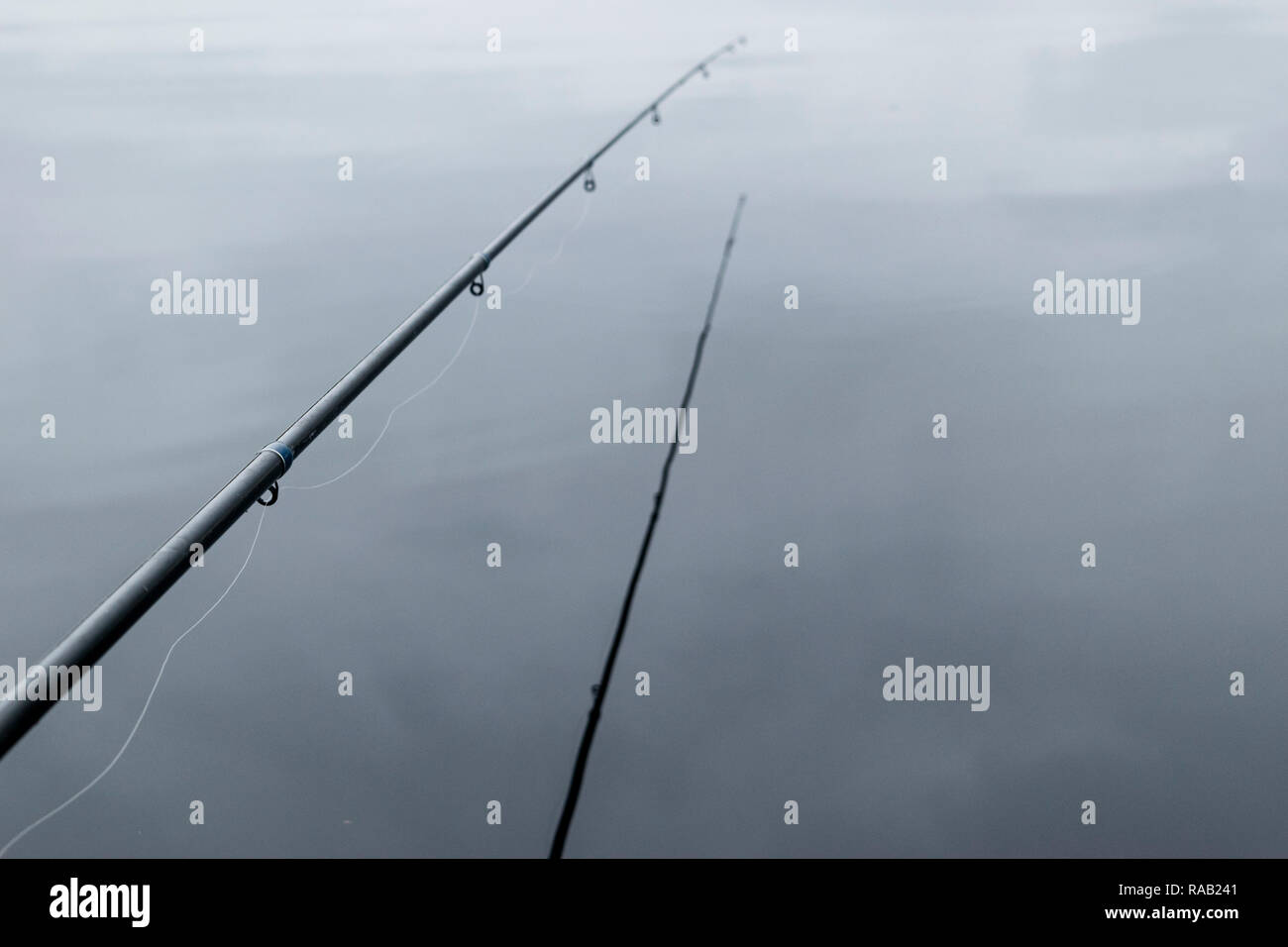 texture of water at lake with fishing rod with the line Stock Photo - Alamy