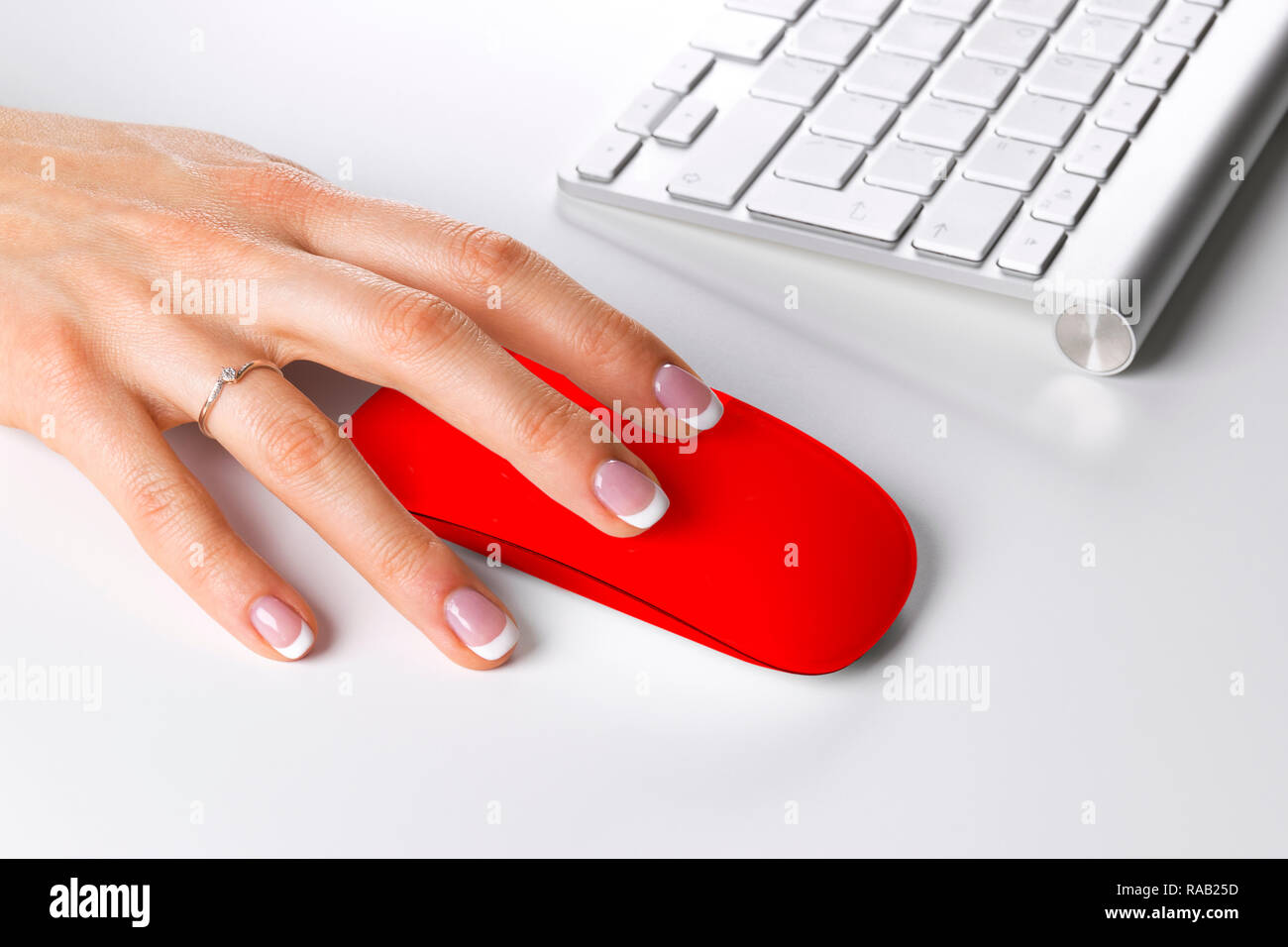 Closeup of business woman hand using wireless computer mouse and ...