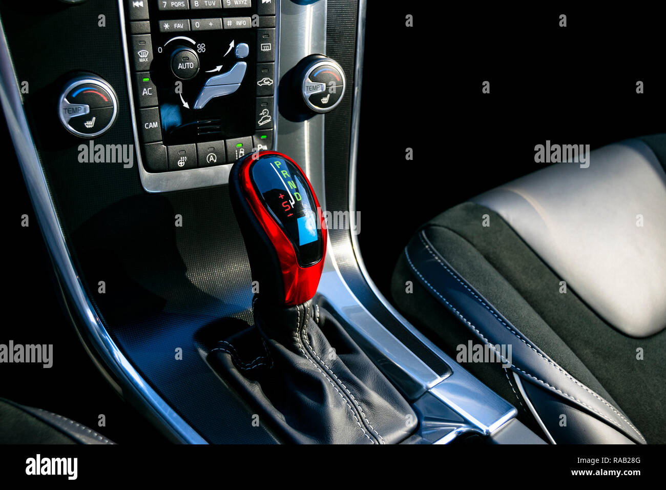 Red Automatic gear stick of a modern car, car interior details with electronic components Stock ...