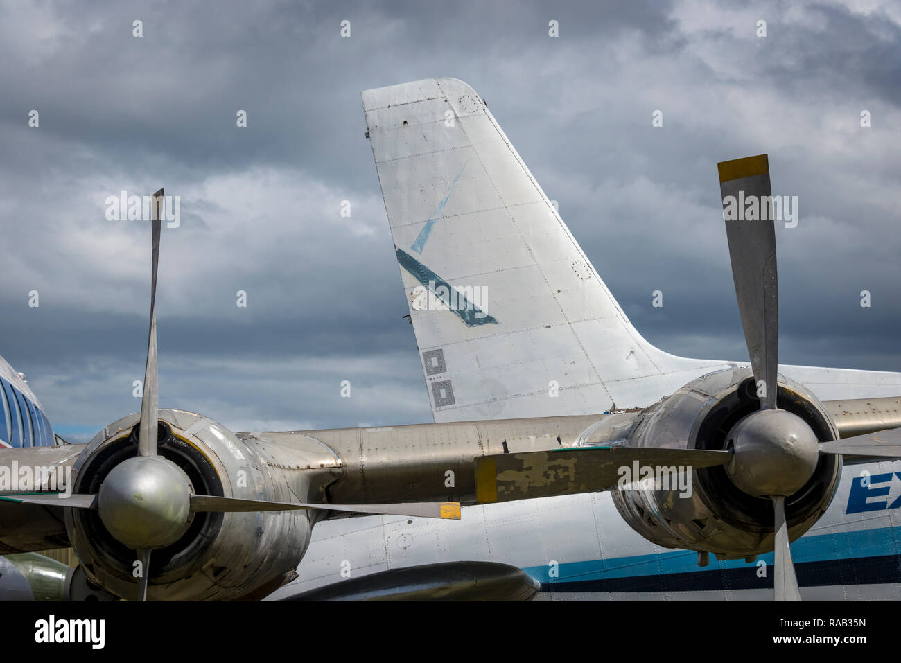 Engines and wing of a decommissioned prop passenger airplane with ...