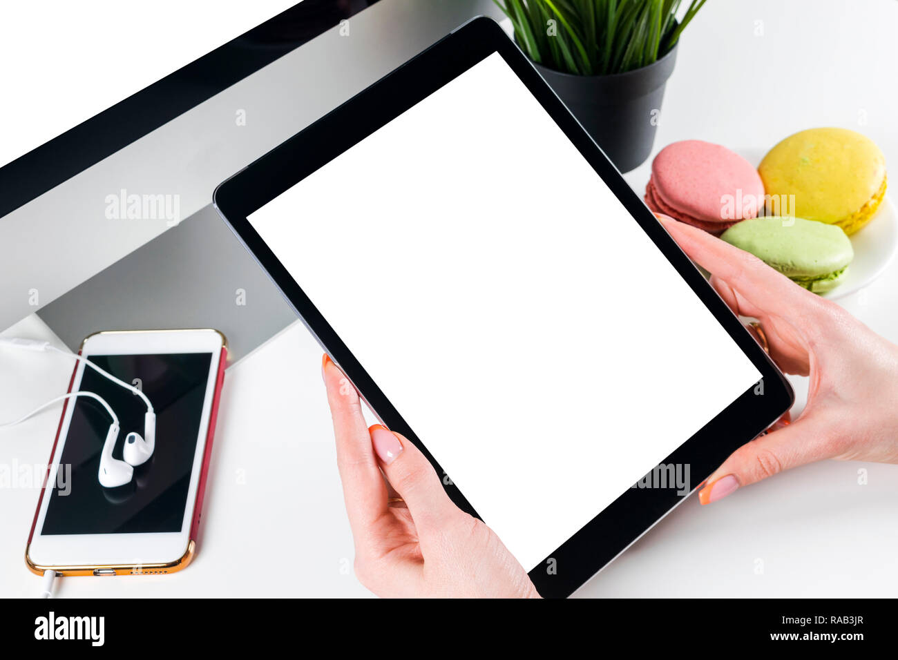 Woman hands holding and using tablet computer with isolated white ...