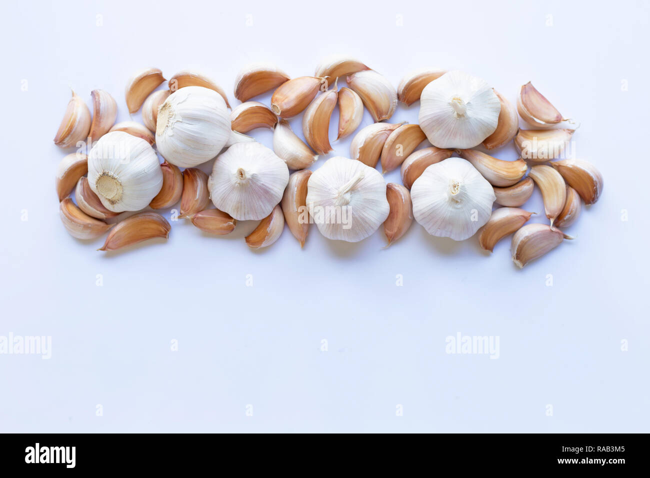 Fresh garlic on white background. Copy space Stock Photo - Alamy