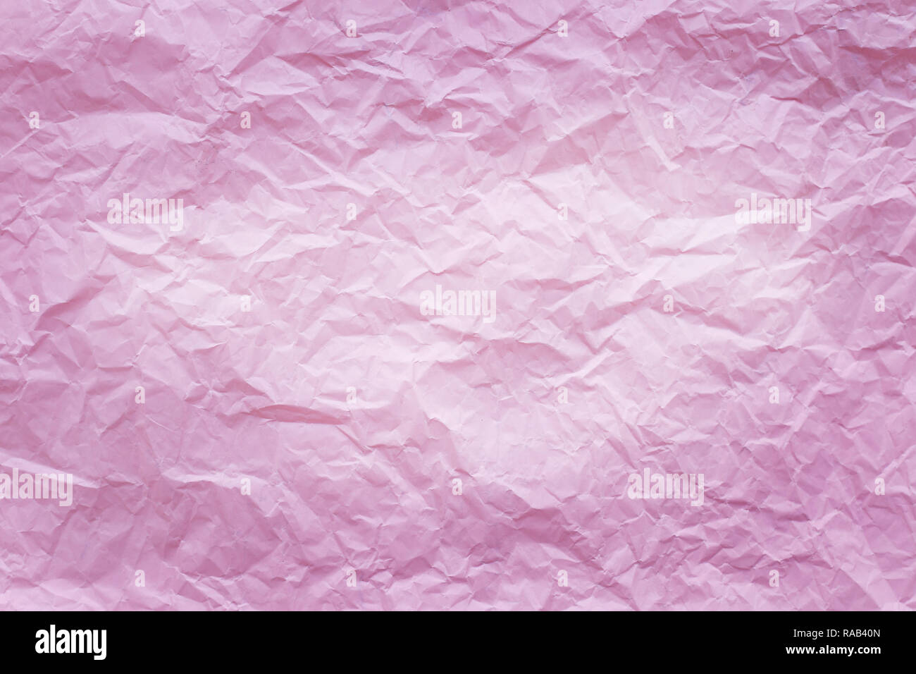 Pink crumpled recycle paper background Stock Photo - Alamy
